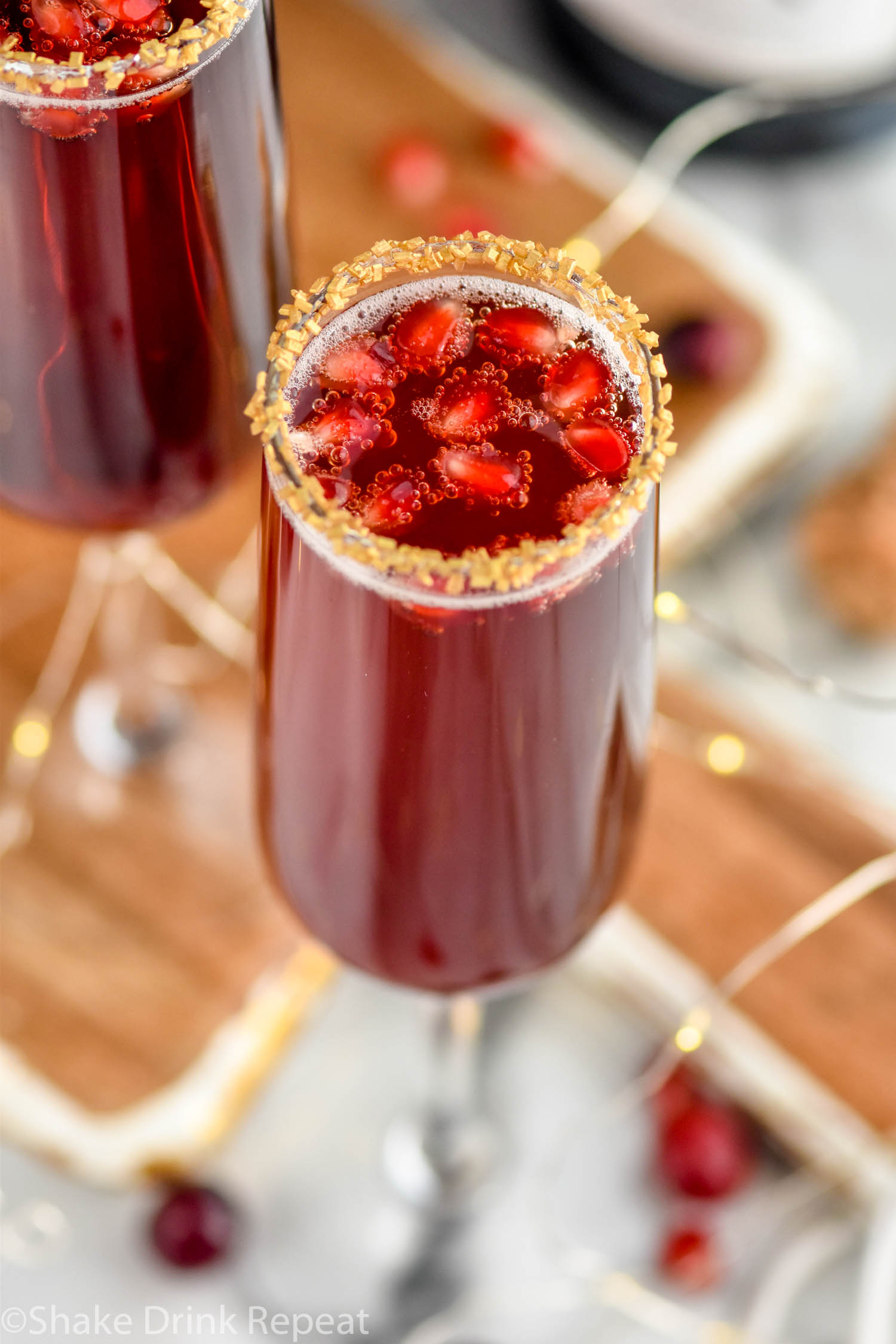 Cranberry Pomegranate Champagne Cocktail - Shake Drink Repeat